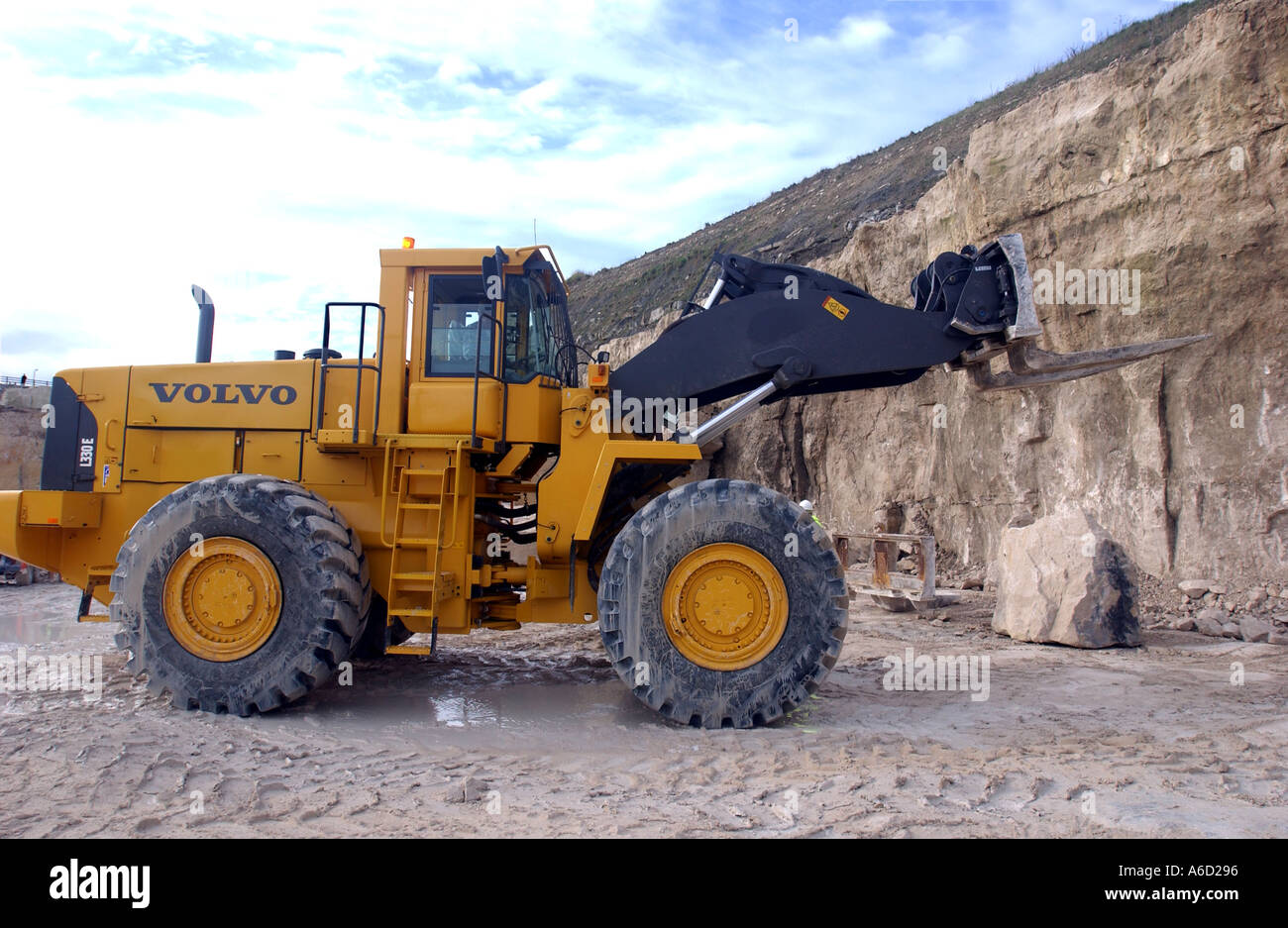 A 48 ton front loader at work in a Portland stone quarry in Dorset ...