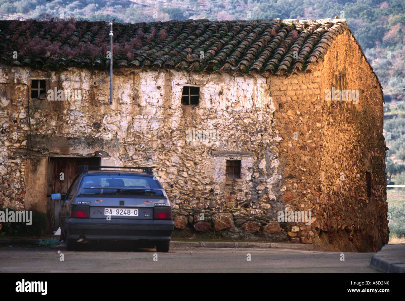 Modern CITROEN car ancient stone house in a traditional country village ...
