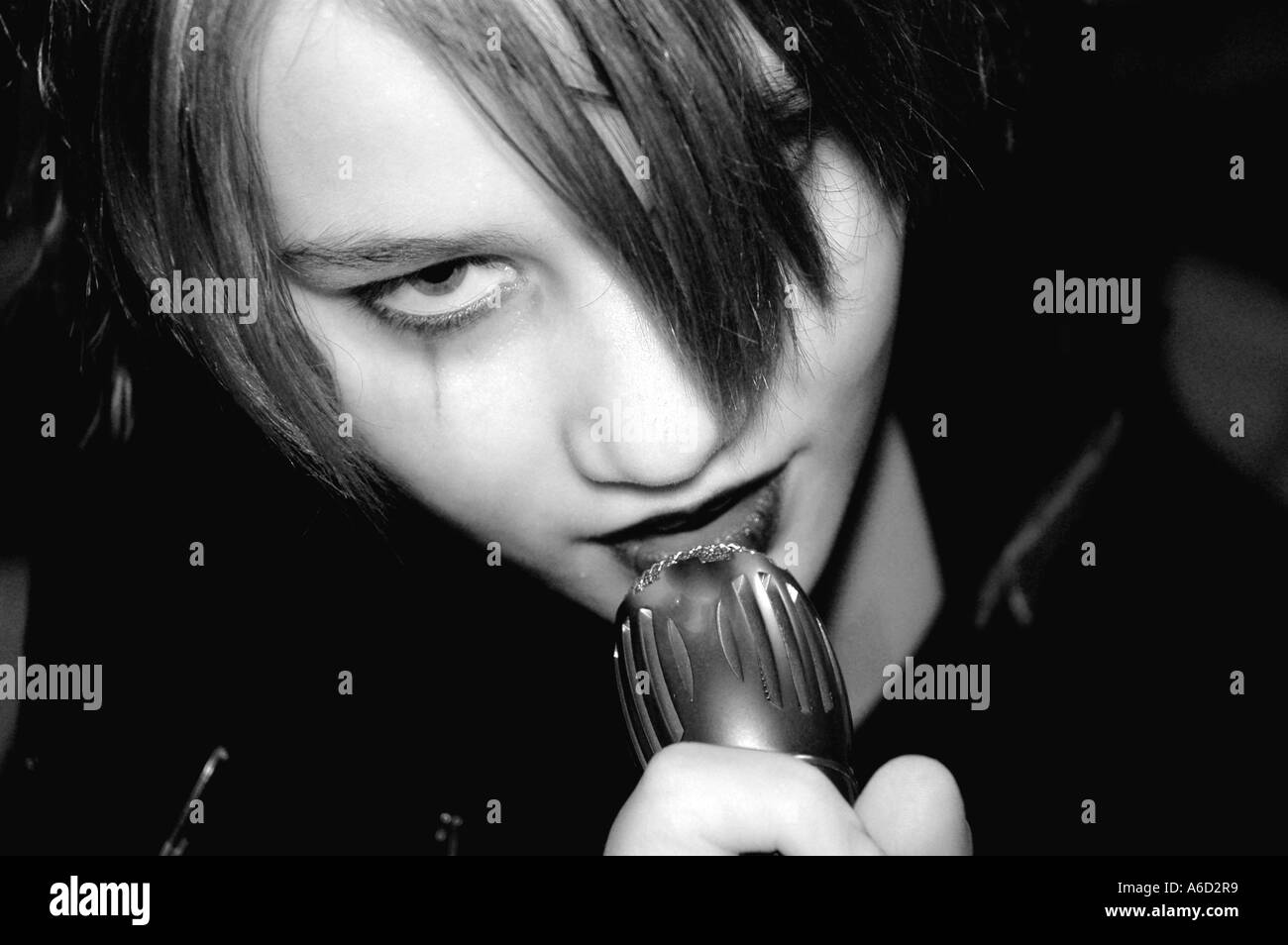 Punk Girl Singing into microphone black and white Stock Photo - Alamy