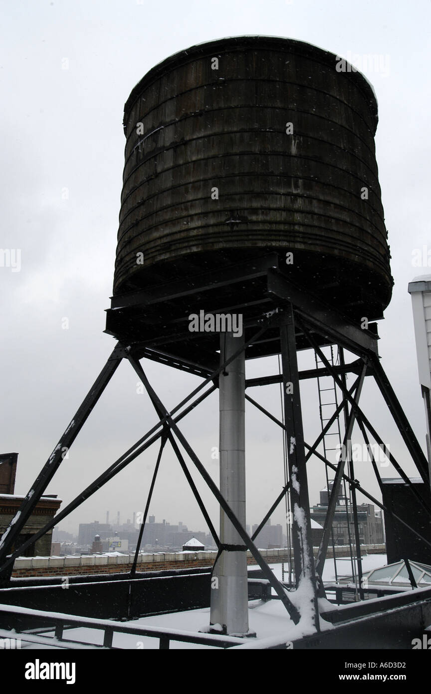 Water tower tank struts roof winter snow NY vertical Stock Photo - Alamy