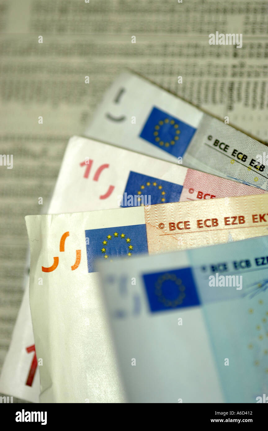 Euro bill laid out over a newspaper Stock Photo - Alamy