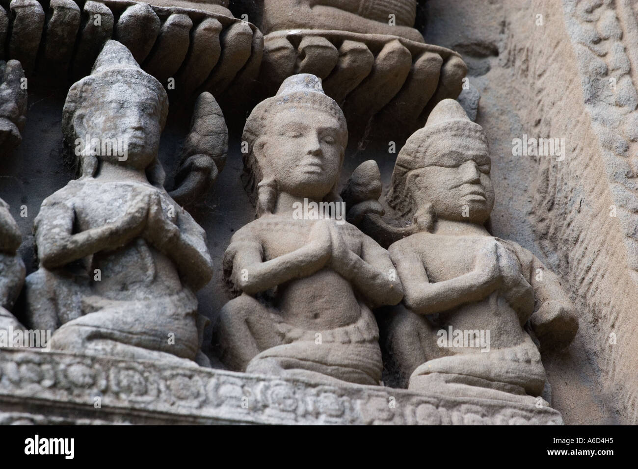 Three bas relief figures in prayer carved on the central Temple ...