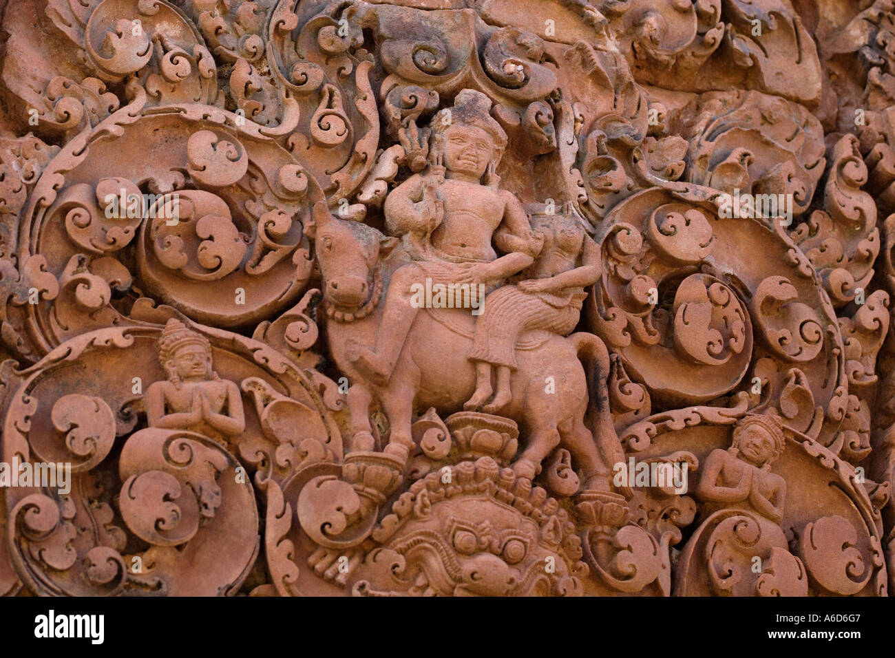 Bas relief of Shiva Uma on Nandi the bull in red sandstone at Banteay ...