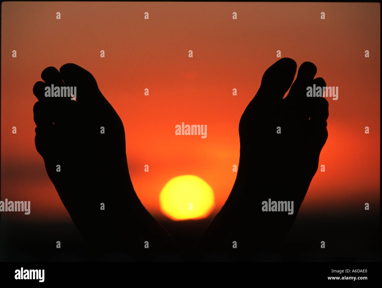 Feet at sunset hi-res stock photography and images - Alamy