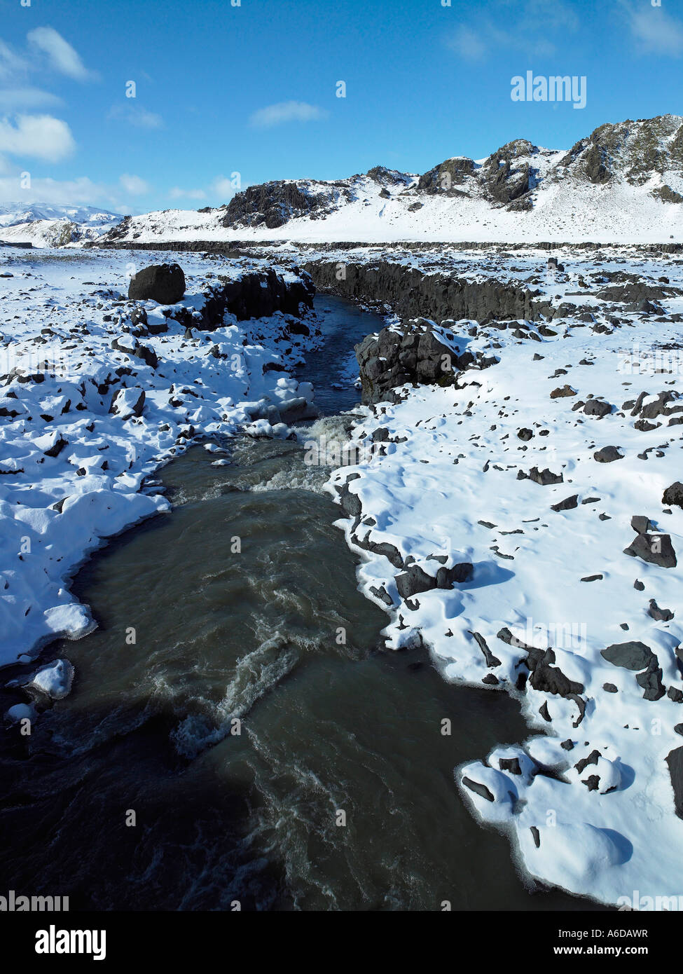 River flowing through a snow covered landscape, Emstrur River, Iceland ...
