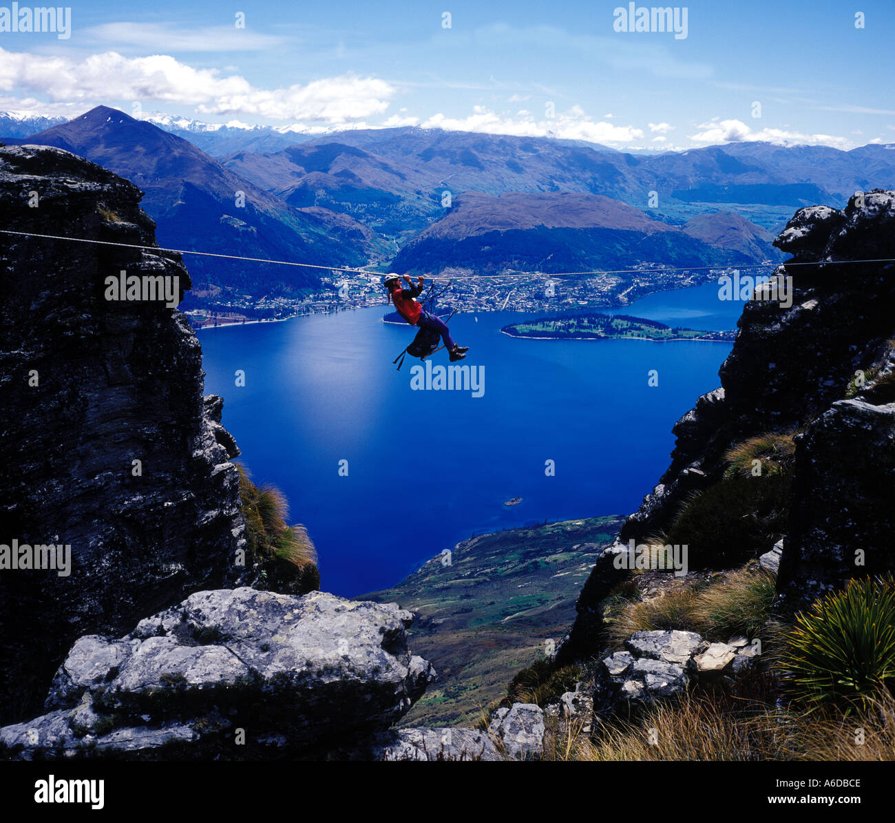 Tyrolian traverse over Queenstown during adventure race Stock Photo - Alamy