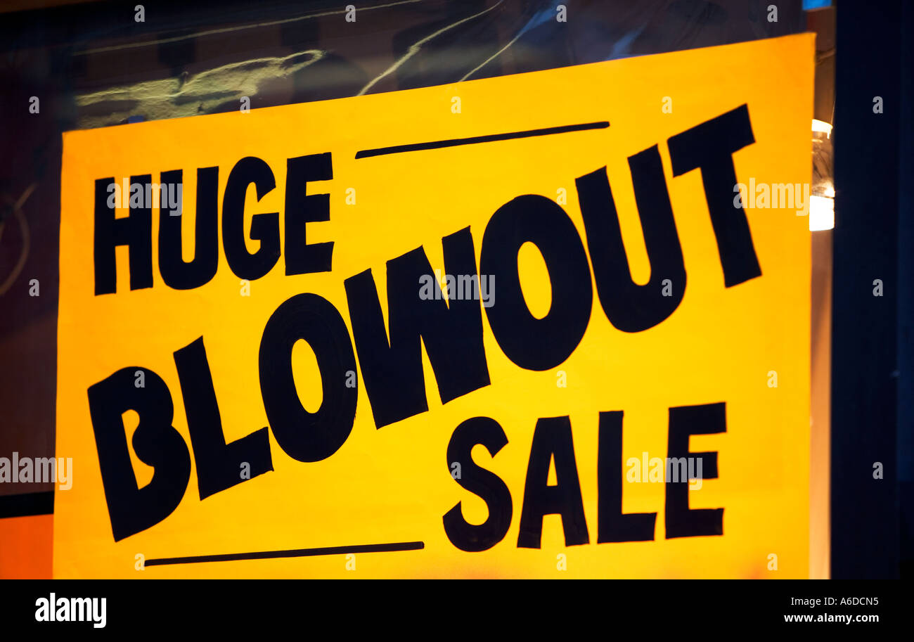HUGE SALE SIGN IN STORE WINDOW Stock Photo - Alamy