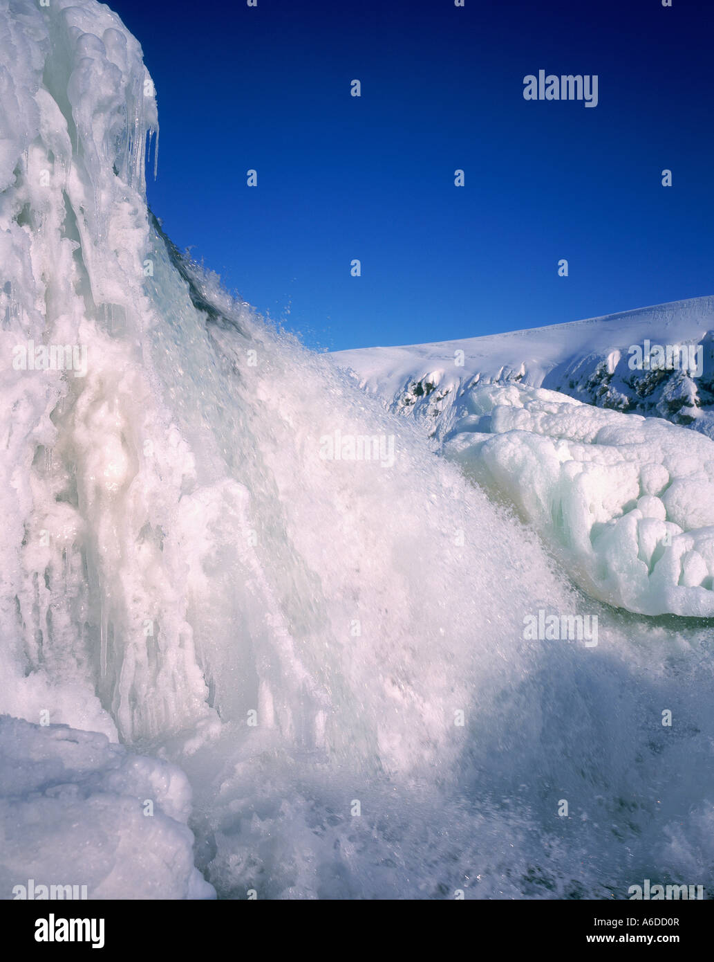 Water falling from a snow covered cliff, Gullfoss Falls, Iceland Stock ...