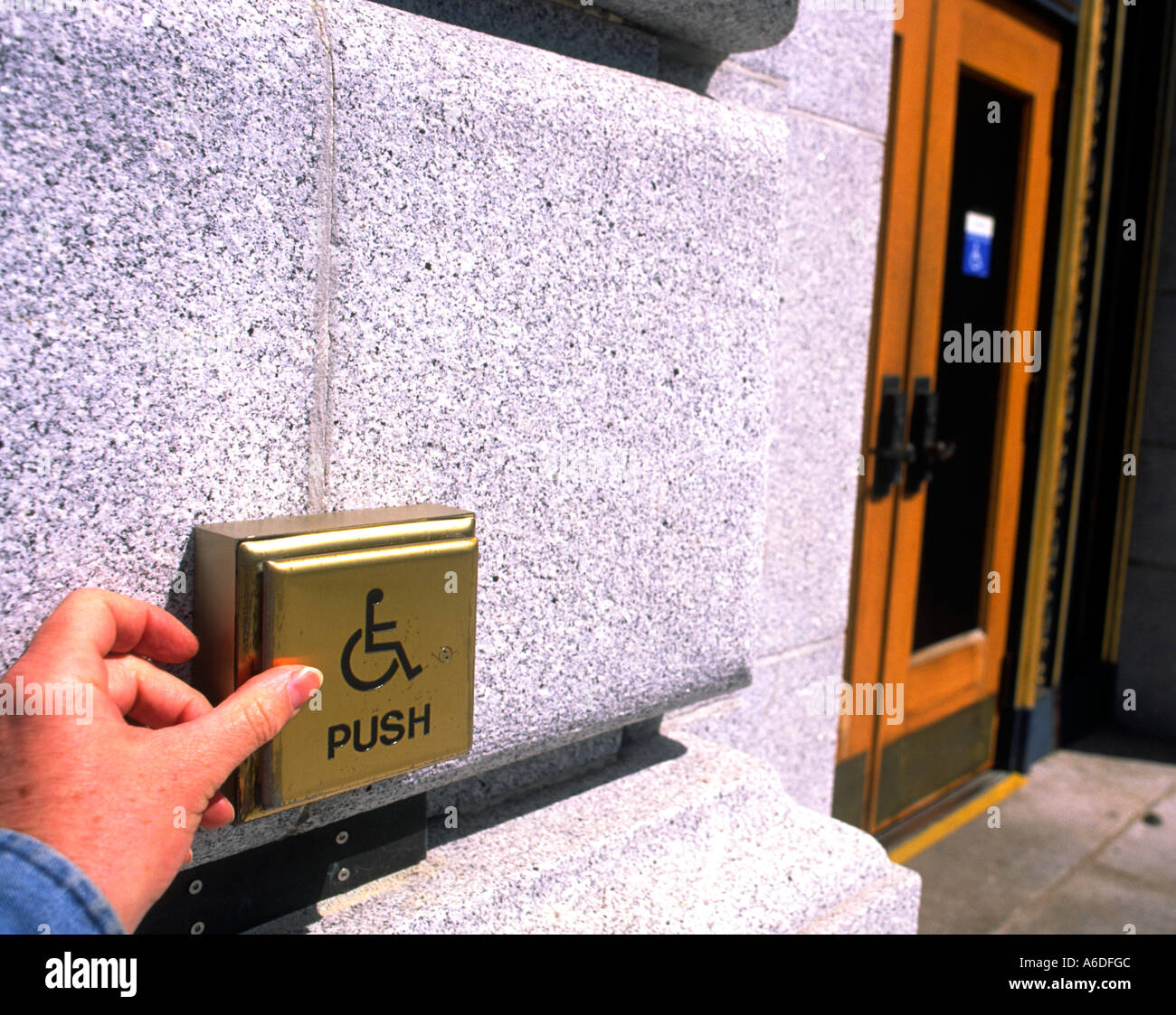 24886 hand pushes button to open City Hall door for handicapped access ... 24886 hand pushes button to open City Hall door for handicapped access ...