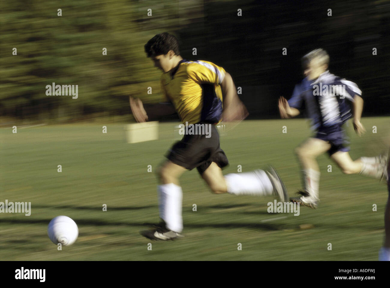 Children playing soccer on a field Stock Photo - Alamy