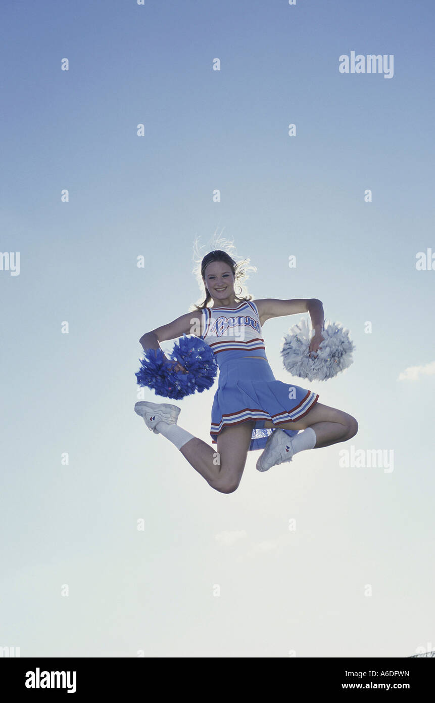 Cheerleader jumping hi-res stock photography and images - Alamy