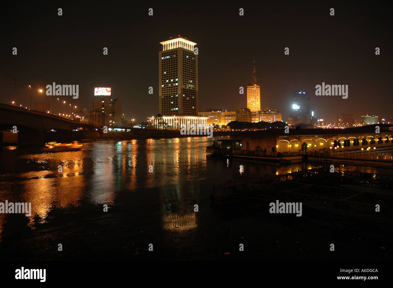 Cairo by night with the lights mirrored in the Nile Main building seen ...