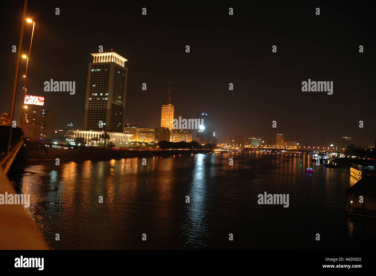 Cairo by night with the lights mirrored in the Nile Main building seen ...