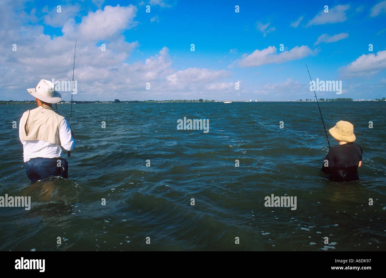 Boy fishing with man Saint Lucie Estuary Indian River Lagoon Martin ...