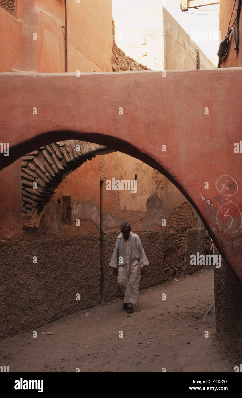 Man walking through the back streets of Marrakesh Morocco North Africa ...