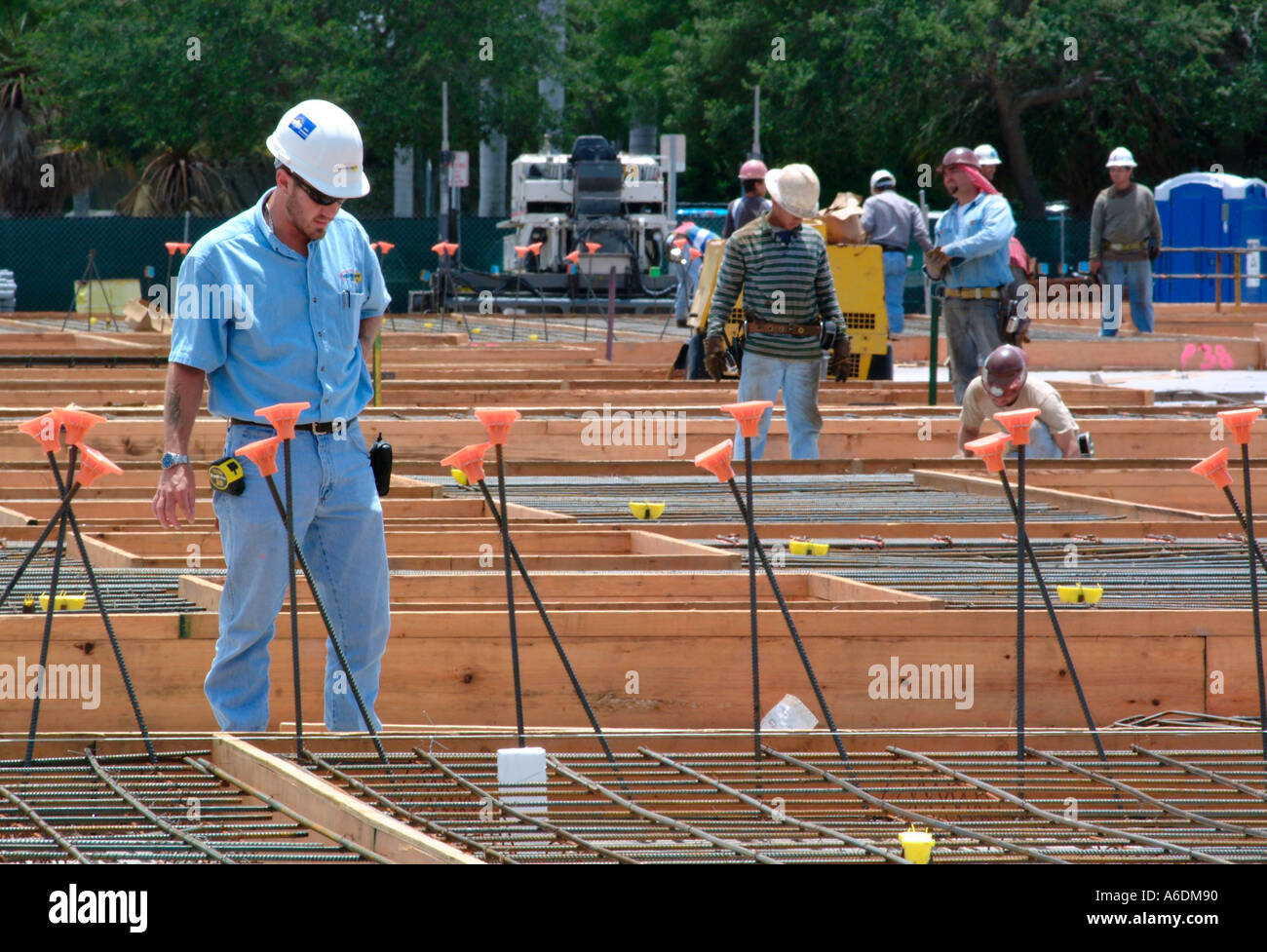 Construction workers preparing rebar for building foundation Stock ...