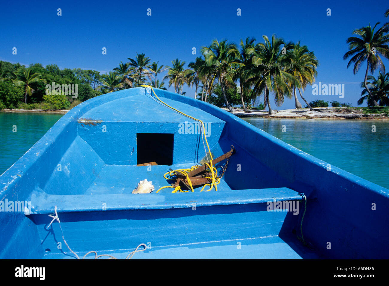 Boat landing on small island Belize Stock Photo - Alamy