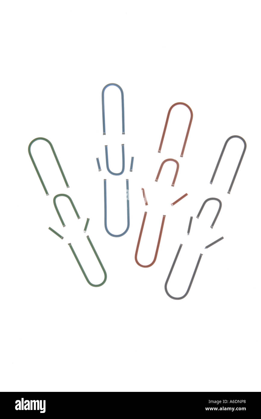 Broken paper clips on a white background Stock Photo - Alamy