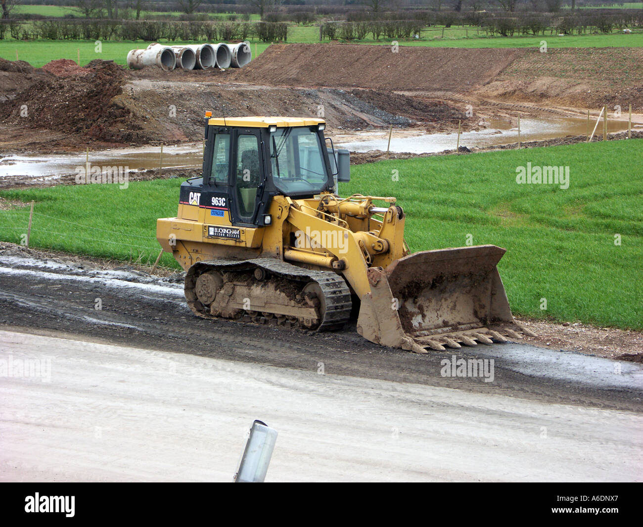 Four Tracking Railway Construction Site. Mechanical digger Caterpillar ...