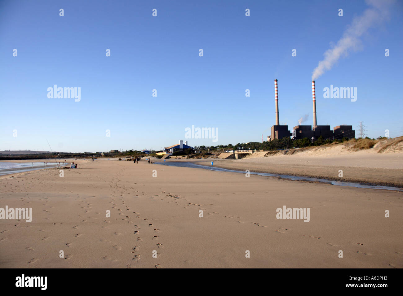 Factory by a beach in Portugal Stock Photo - Alamy