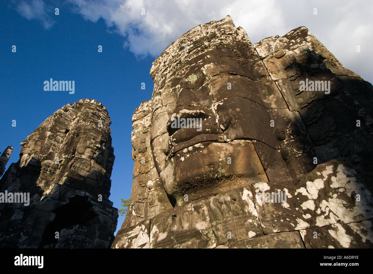 The face towers of The Bayon at Angkor Thom the largest Khmer city ever ...