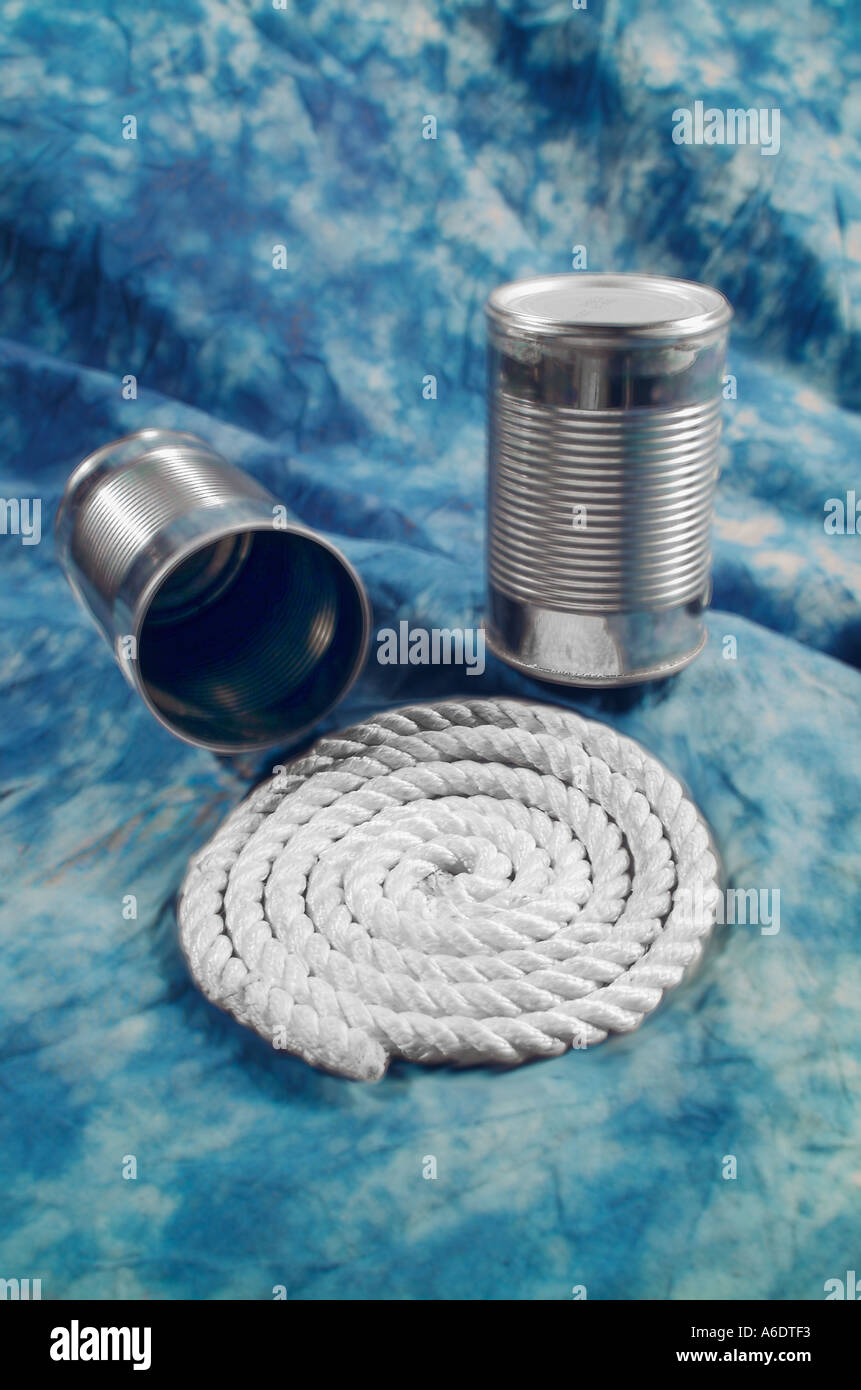 two cans and string communication childrens games telephones Stock ...