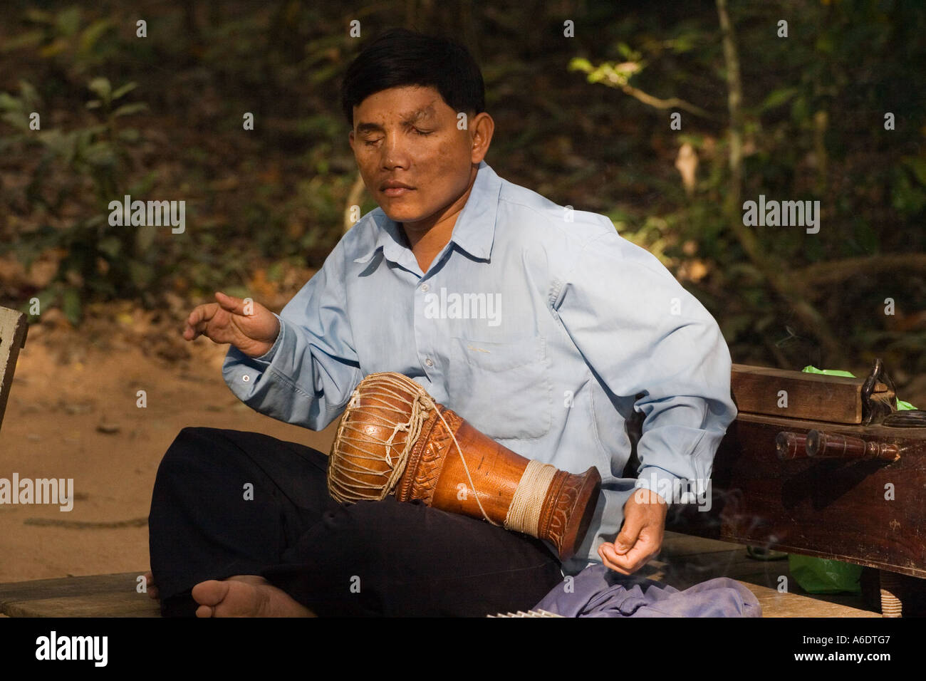 Blind drummer a victim of a land mind preforms at the Angkor Wat temple ...