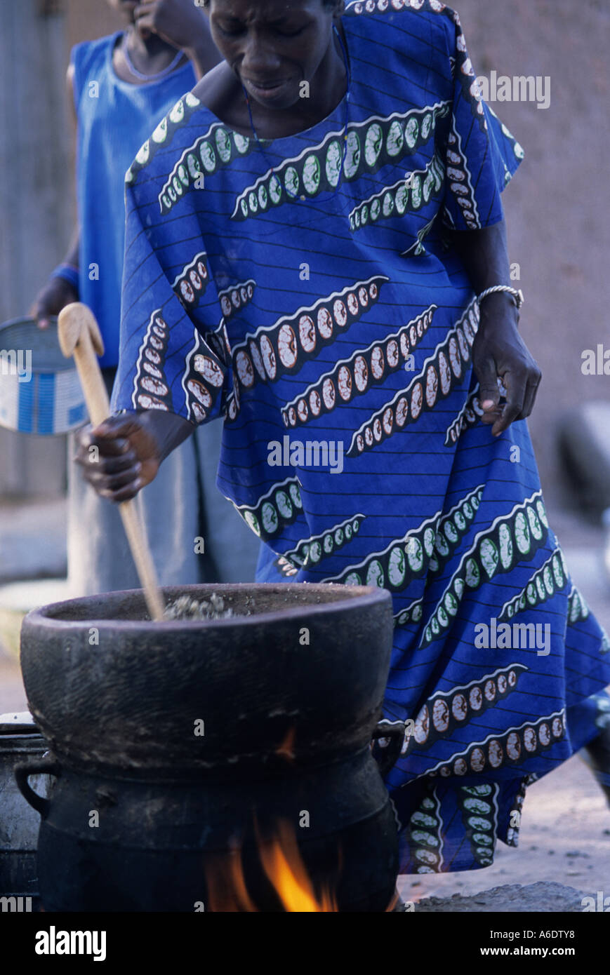 A woman cooking maize Salia in the Beleco region Mali Stock Photo - Alamy