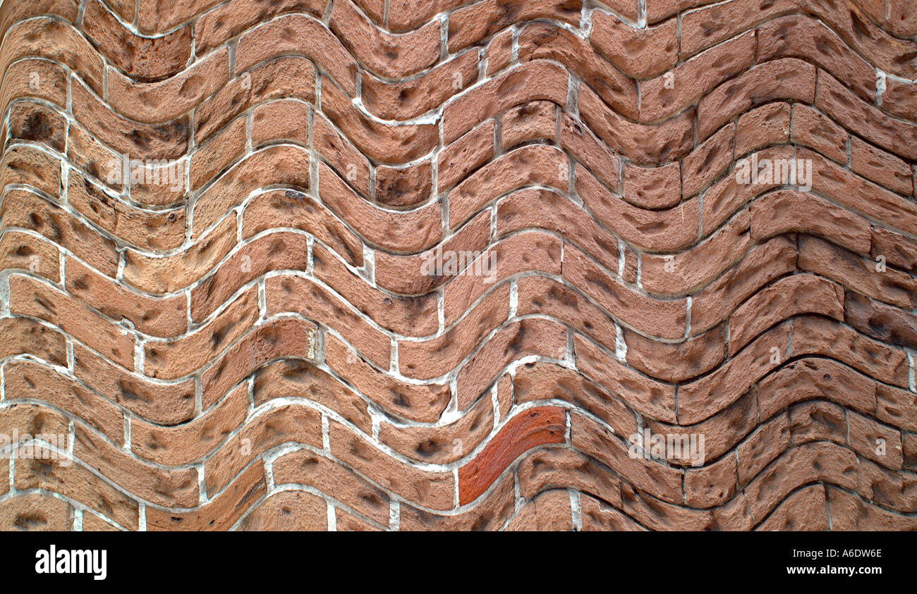 wavy red bricks making up a wall Stock Photo - Alamy