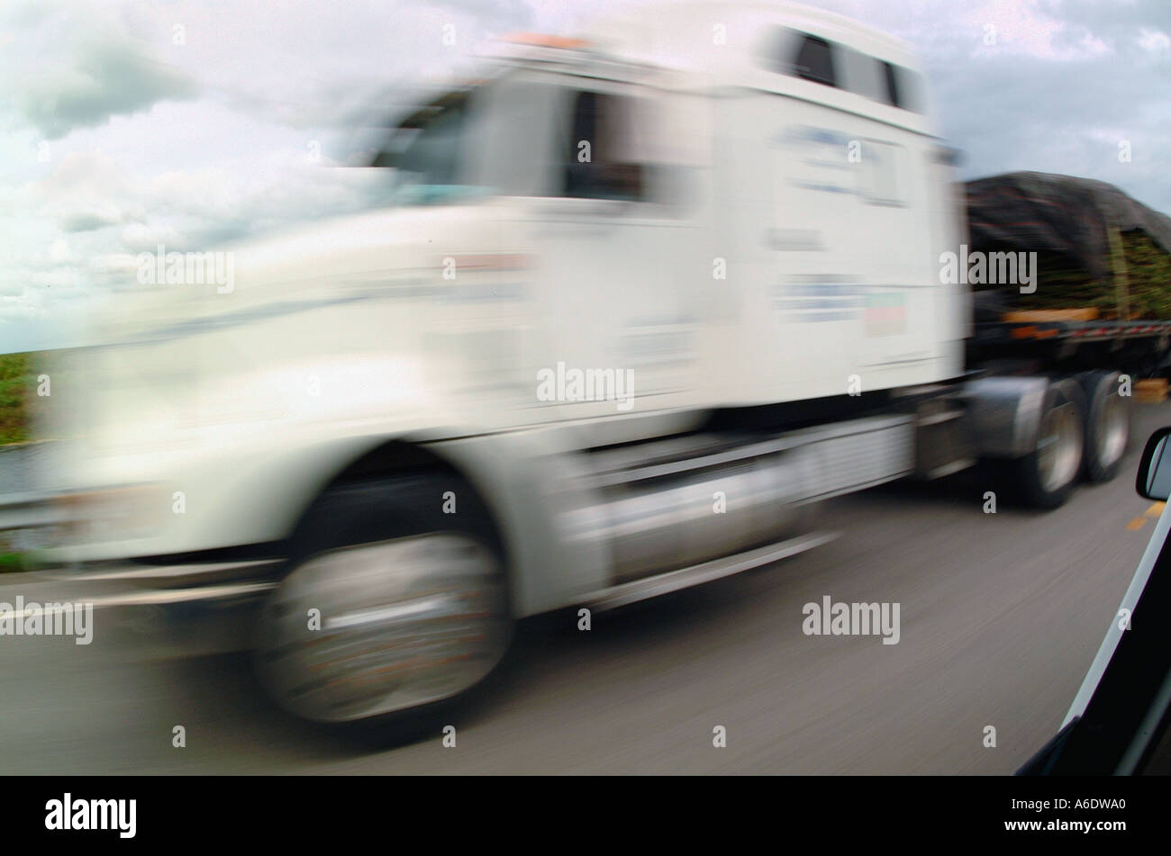 traffic truck passing speeding fast semi motion blur transportation ...