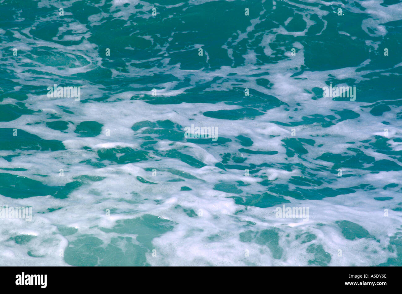 foaming ocean water from wave action background Stock Photo - Alamy