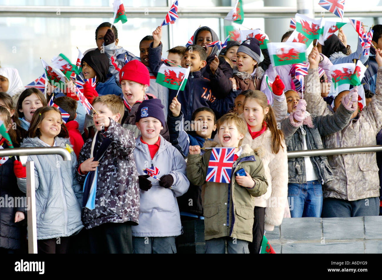 Primary school children wave flags at the opening of the Senedd ...