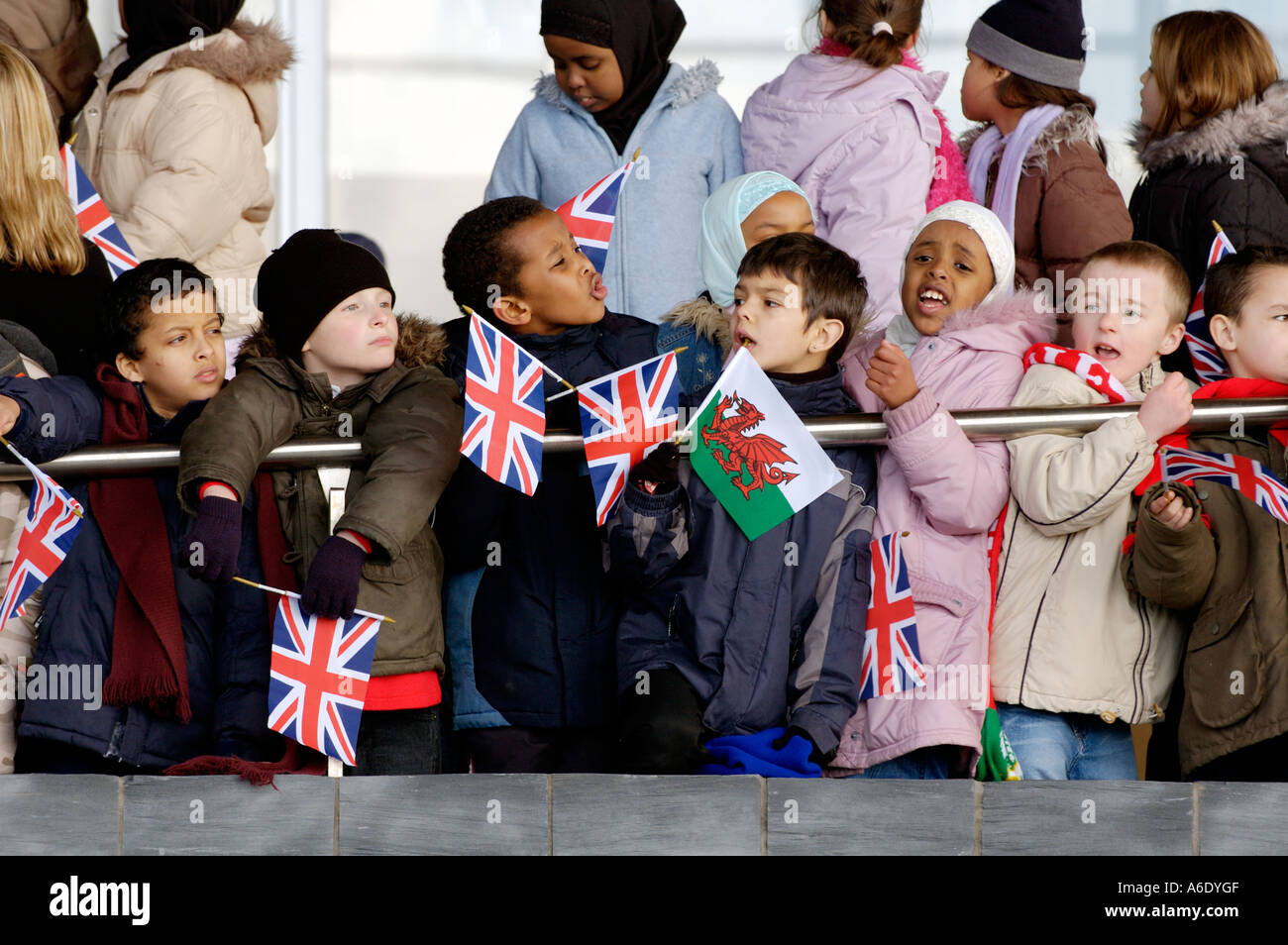 Primary school children wave flags at the opening of the Senedd ...