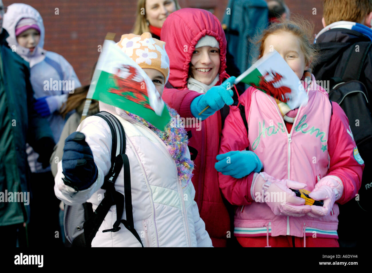 Primary school children wave flags at the opening of the Senedd ...