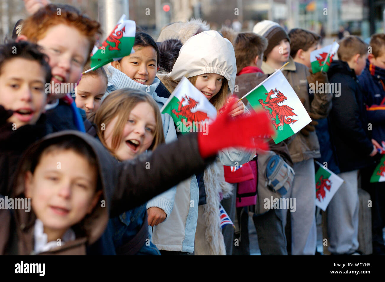 Primary school children wave flags at the opening of the Senedd ...