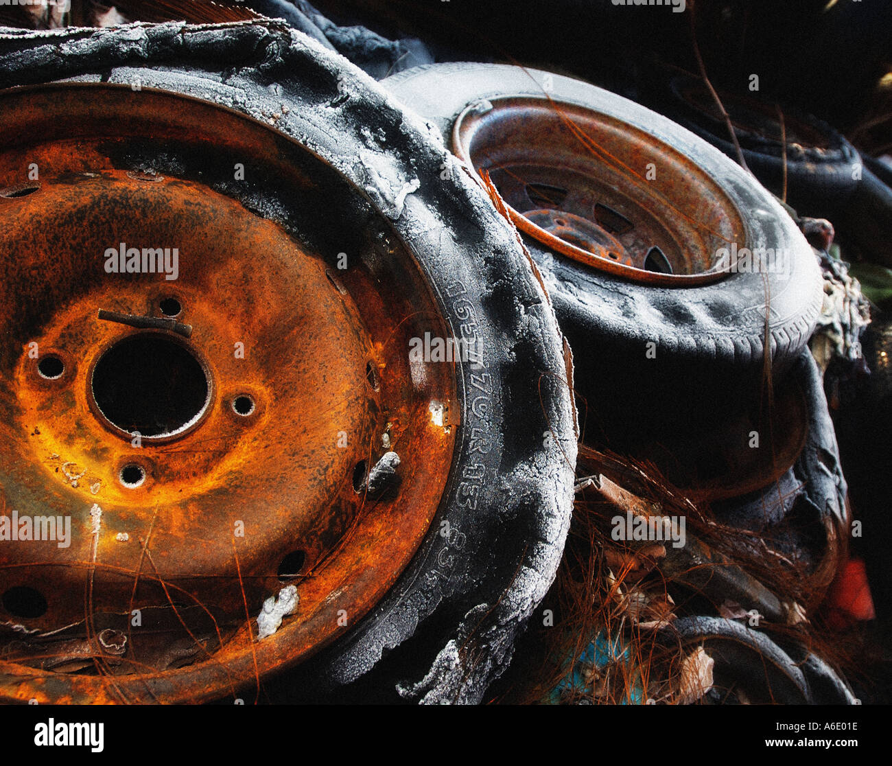 Discarded tyres and rusting wheels Stock Photo - Alamy