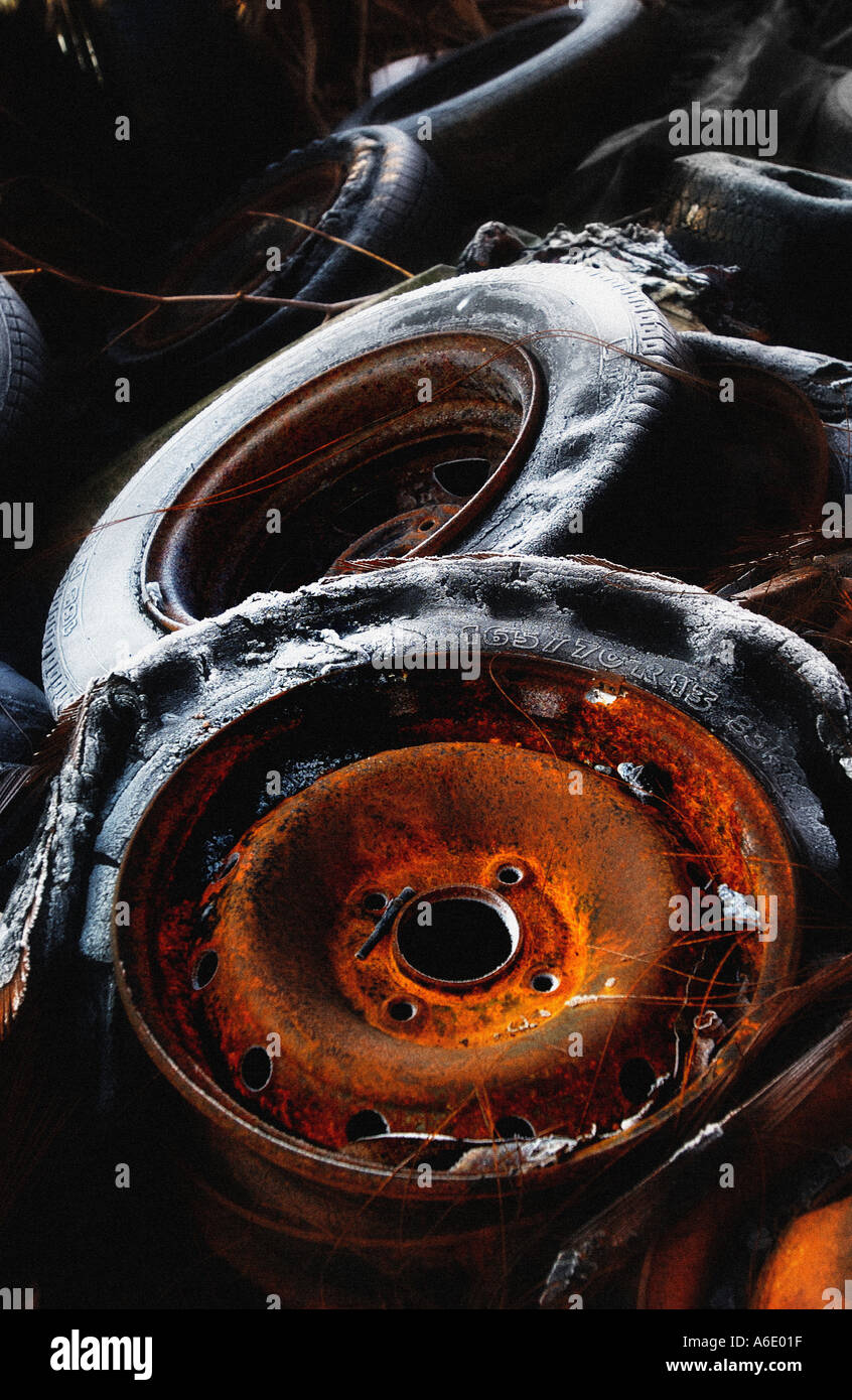 Discarded tyres and rusting wheels Stock Photo - Alamy