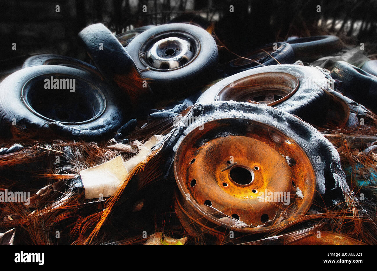 Discarded tyres and rusting wheels Stock Photo - Alamy