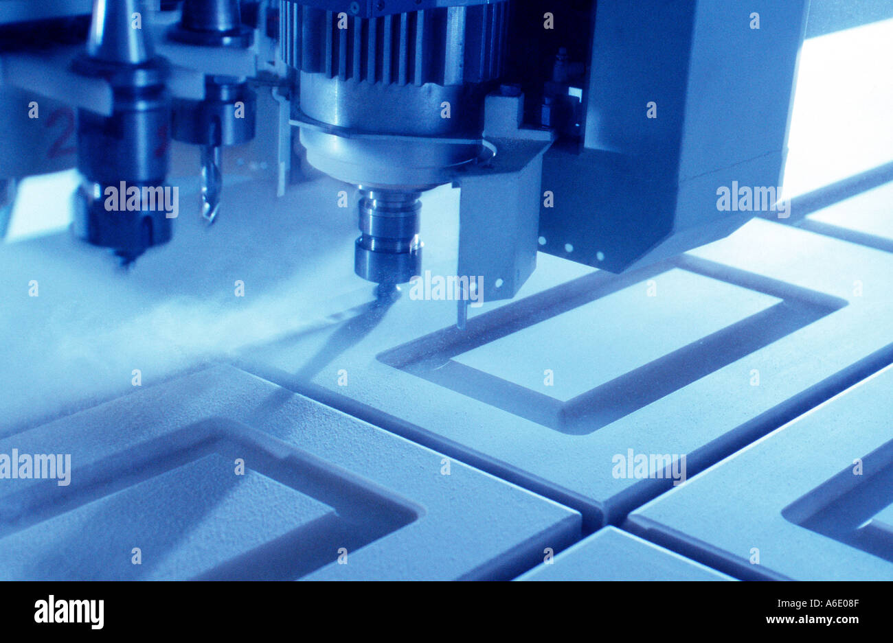 Automated mill cuts a design in wood panel Stock Photo - Alamy