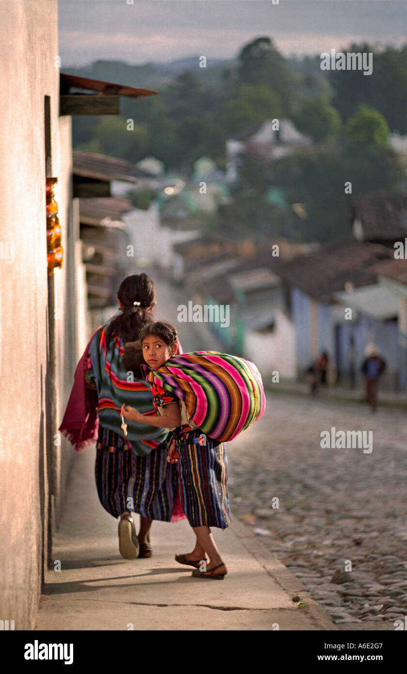 Guatemalan Maya girl turning whilst walking home Chichicastenango El ...