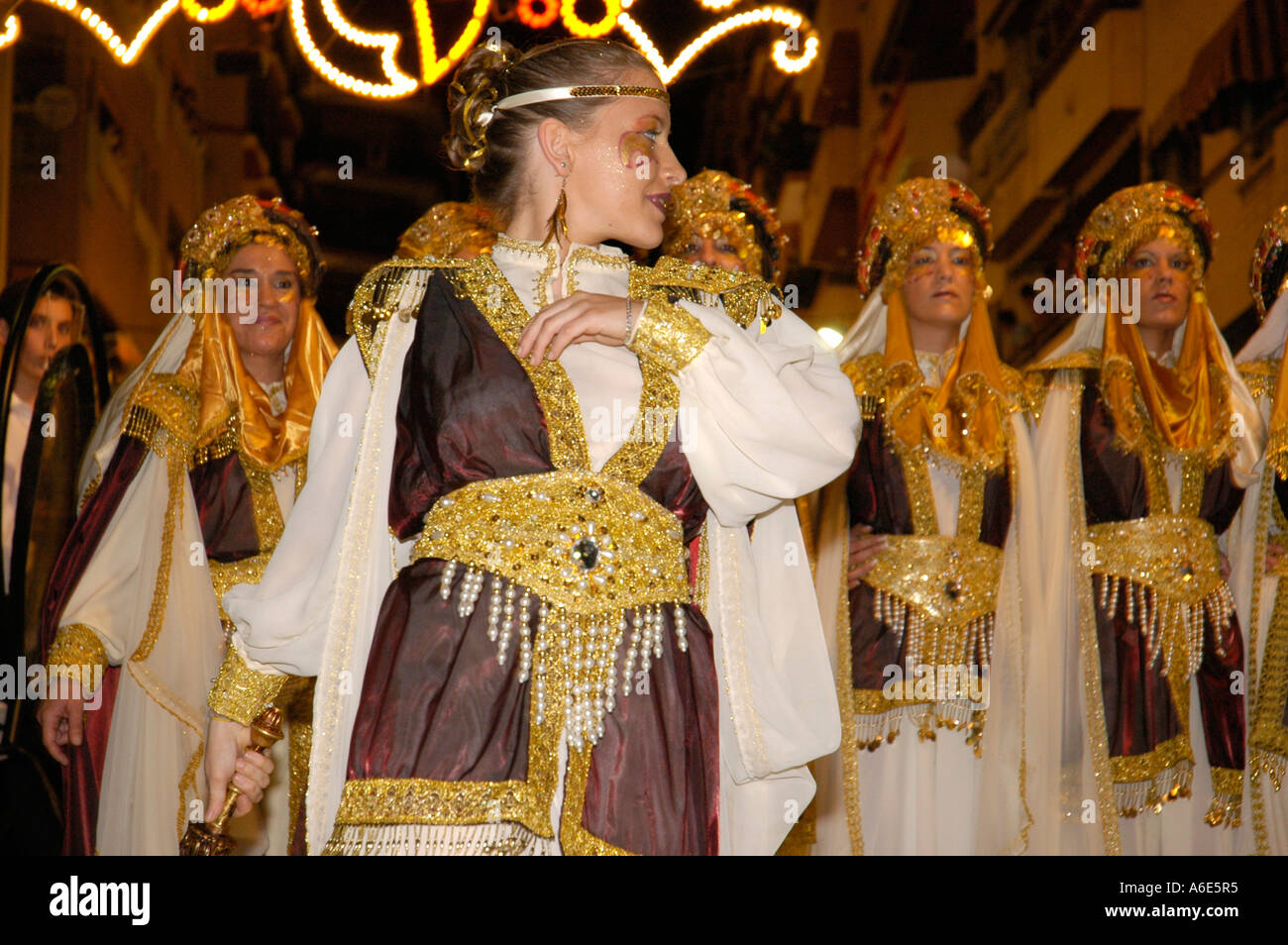 Festively dressed women at a parade, dance, Fiesta, move, moros y ...