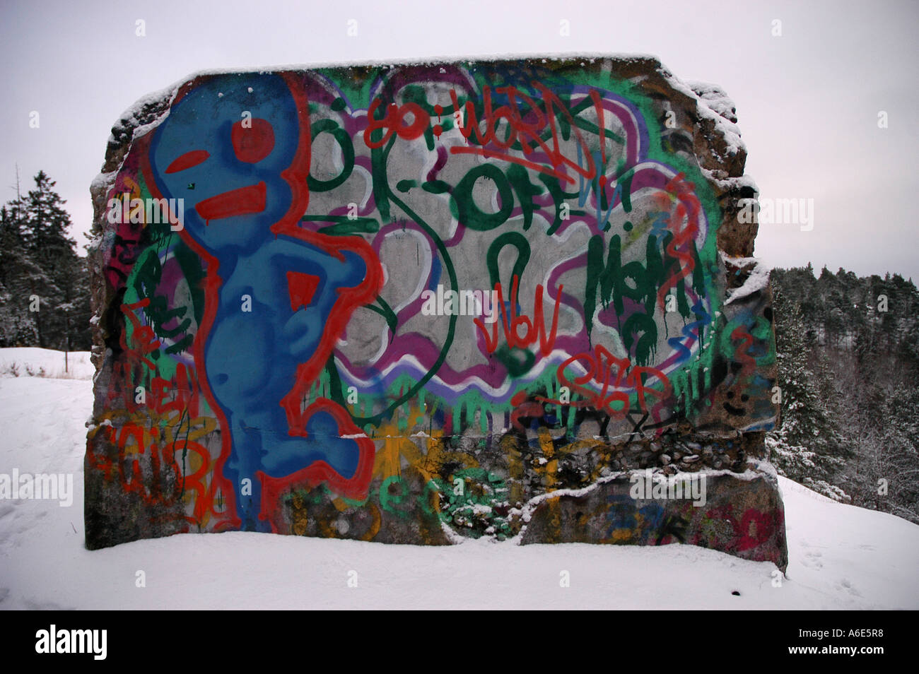 Graffiti on an old army bunker on a forested mountain near Stockholm ...