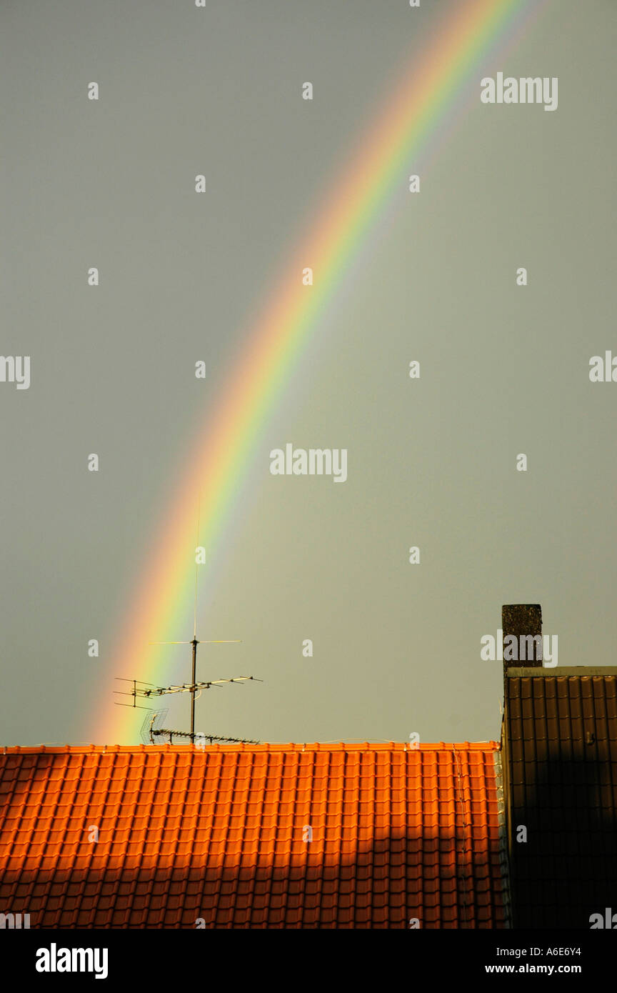 Rainbow over roofs, house roof, aerial, Germany Stock Photo - Alamy