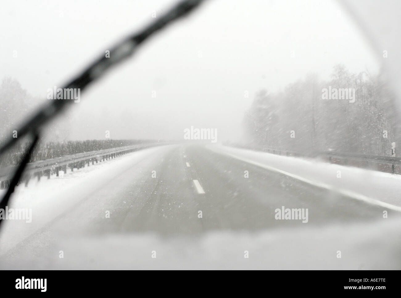 Snowfall and poor visibility on a german Autobahn in winter Stock Photo ...