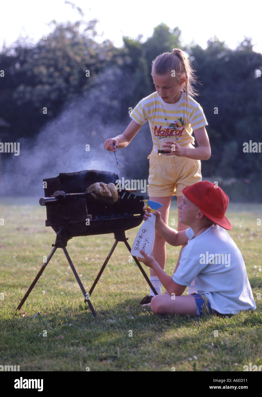 Children with Barbecue Stock Photo - Alamy