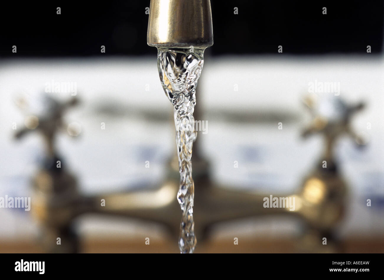 Running water from kitchen sink taps in a house in Suffolk, UK Stock ...