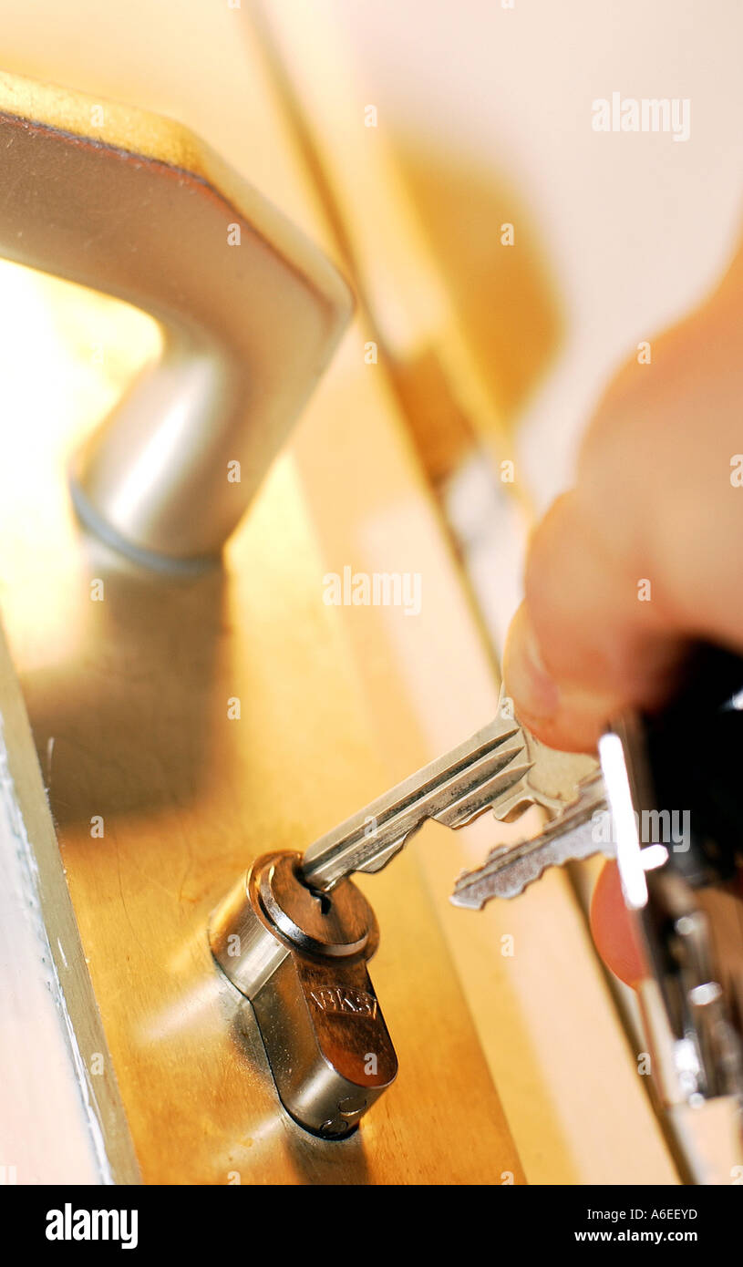 Unlocking the door - Inserting the key Stock Photo - Alamy