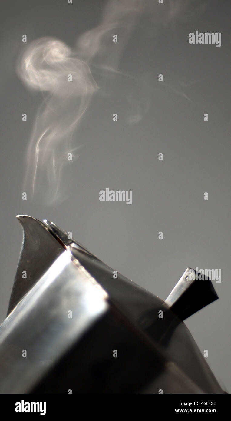 Steaming espresso coffee pot Stock Photo - Alamy