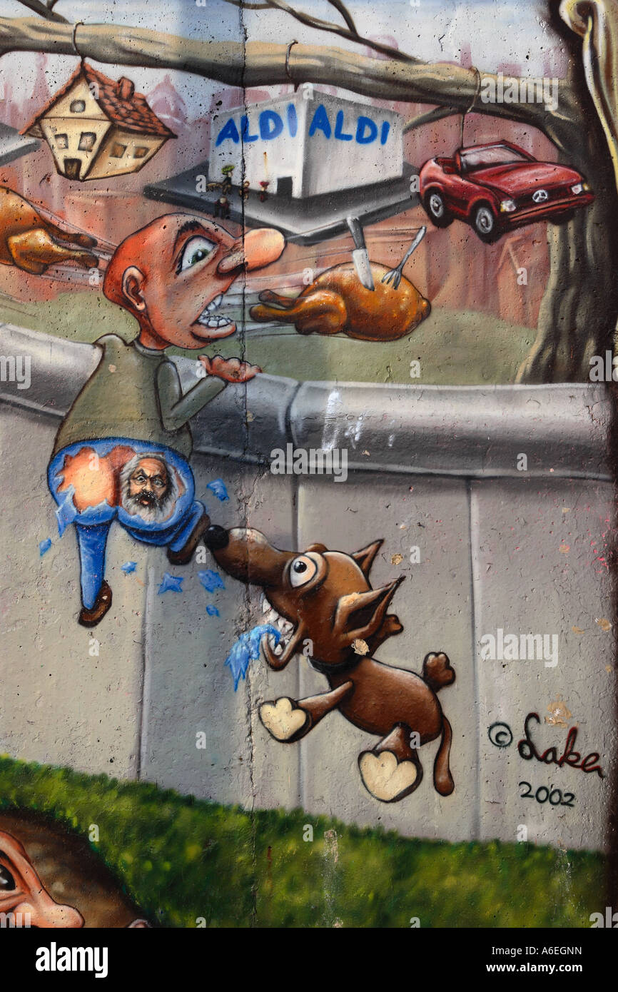 A section of a mural on the Berlin Wall depicting an East German trying ...