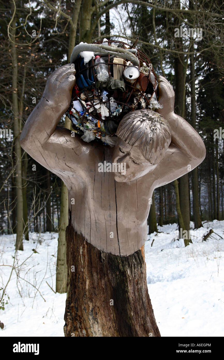 A tree trunk carving with an environmental theme echoing Atlas ...